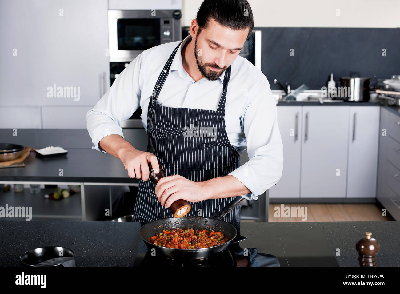 Chef preparing dishes in a frying pan. Cooking. Stock image Stock Photo ...