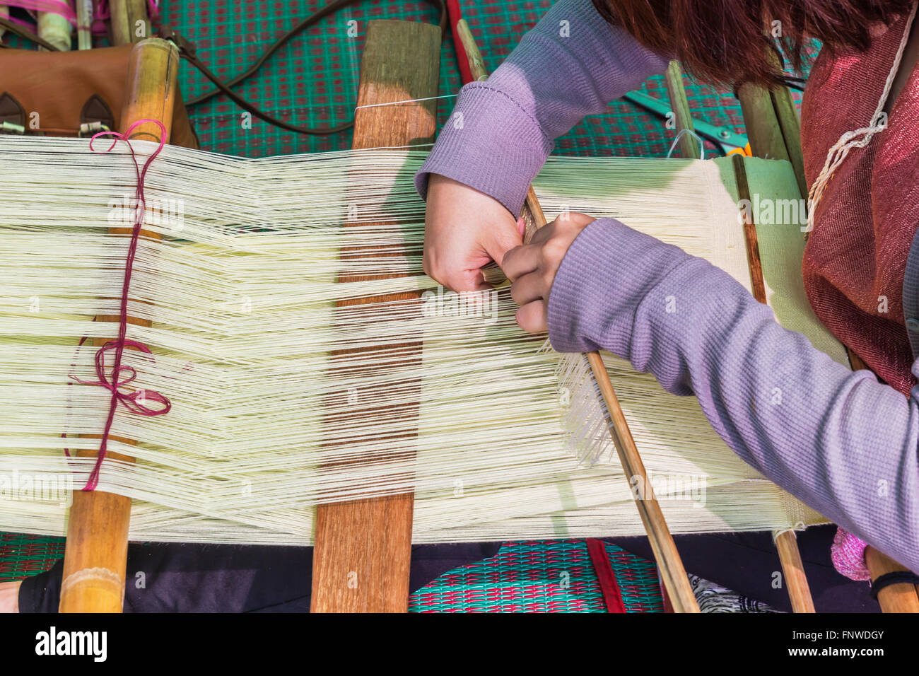 Woman weaving carpet on loom hi-res stock photography and images - Alamy