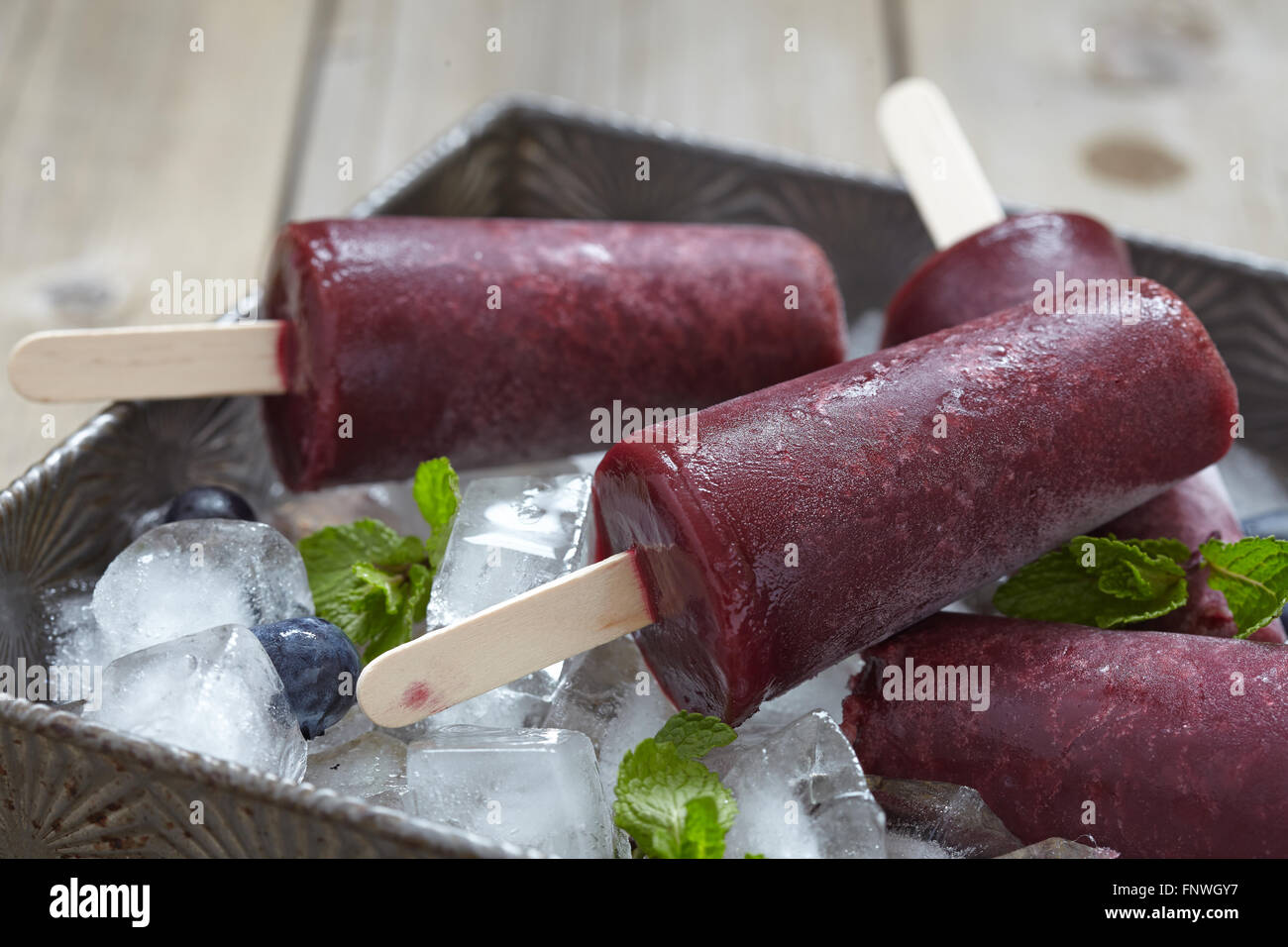 Blueberry ice cream popsicles Stock Photo - Alamy