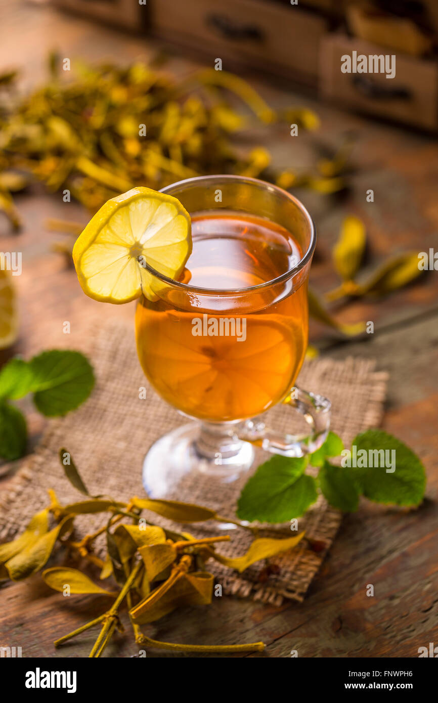 Glass cup with fresh herbal tea Stock Photo - Alamy
