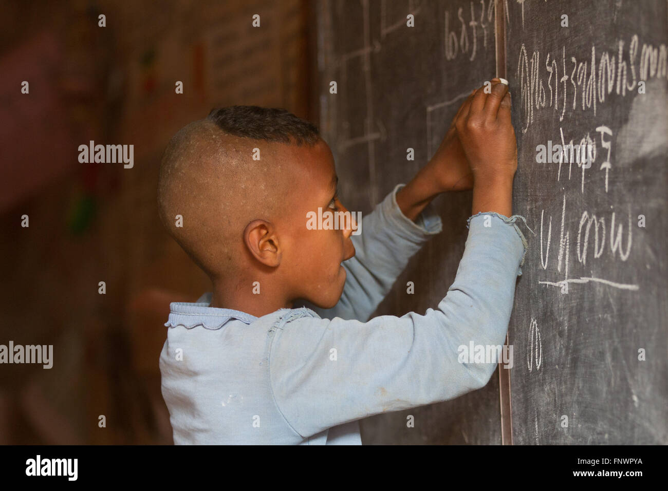 Children Writing On Blackboard High Resolution Stock Photography and ...