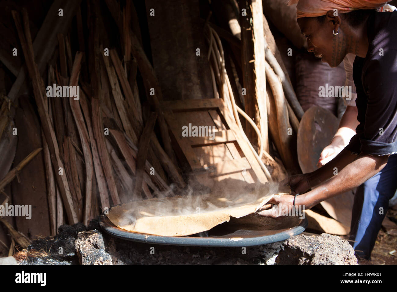 Women making injera hi-res stock photography and images - Alamy