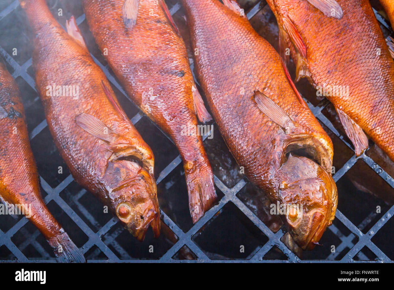 The fish is smoked in a smokehouse Stock Photo - Alamy