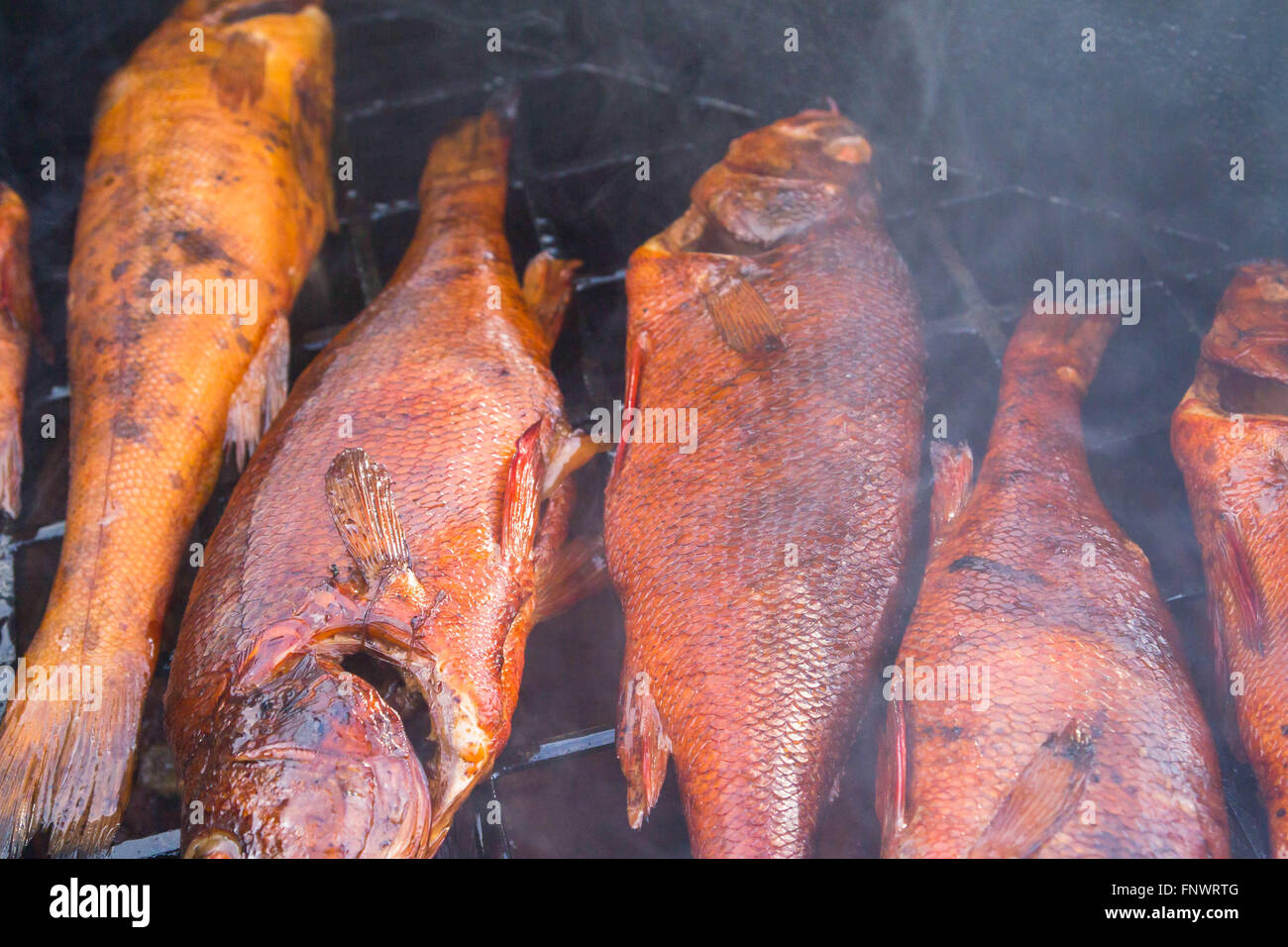 The fish is smoked in a smokehouse Stock Photo - Alamy