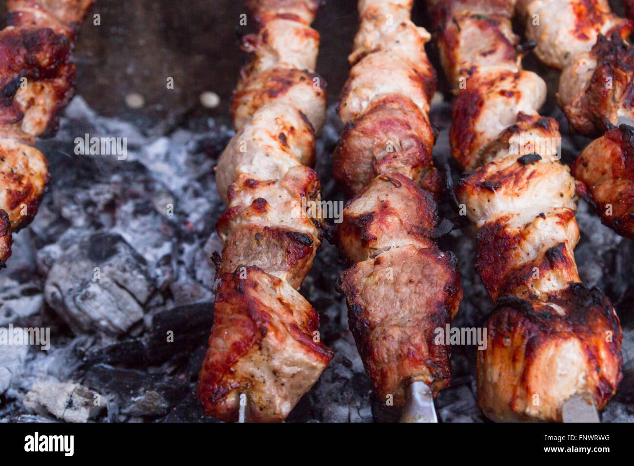 Grilled pork kebab cooked on skewers Stock Photo - Alamy