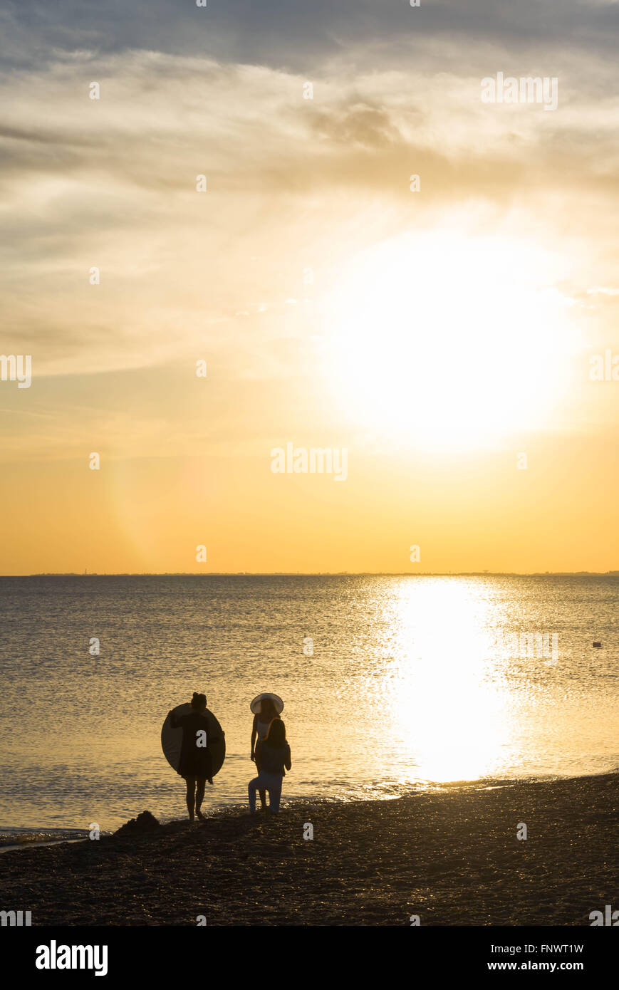 Photoshoot at sunset on the beach Stock Photo - Alamy