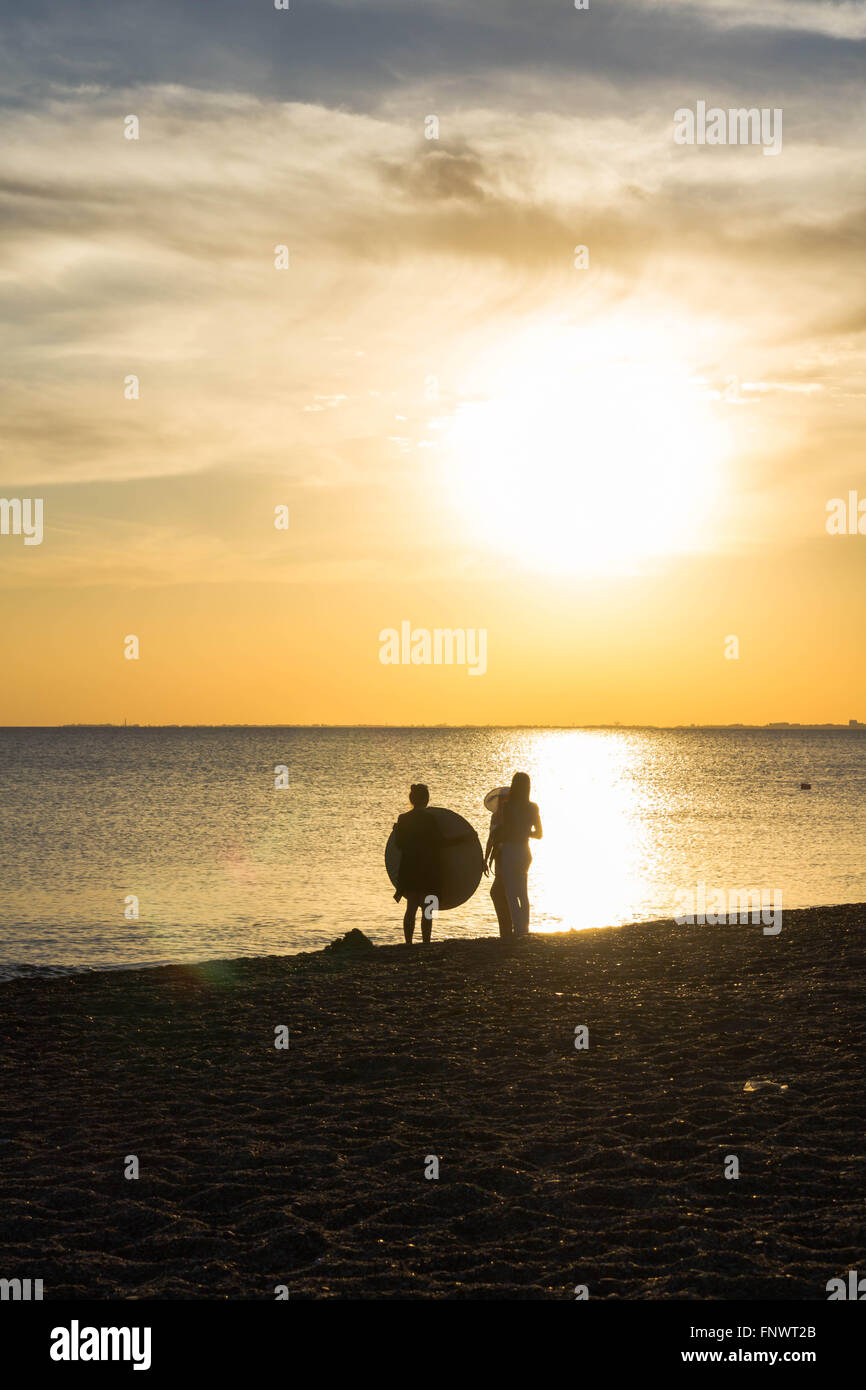 Photoshoot at sunset on the beach Stock Photo - Alamy