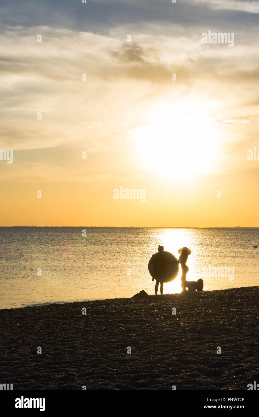 Photoshoot at sunset on the beach Stock Photo - Alamy