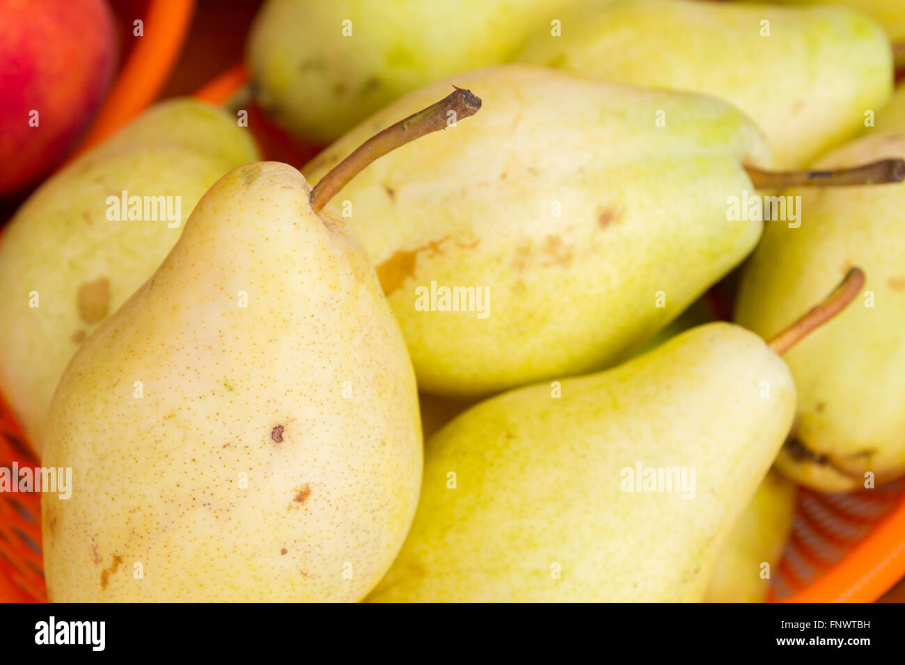 Delicious yellow pears on the counter Stock Photo - Alamy