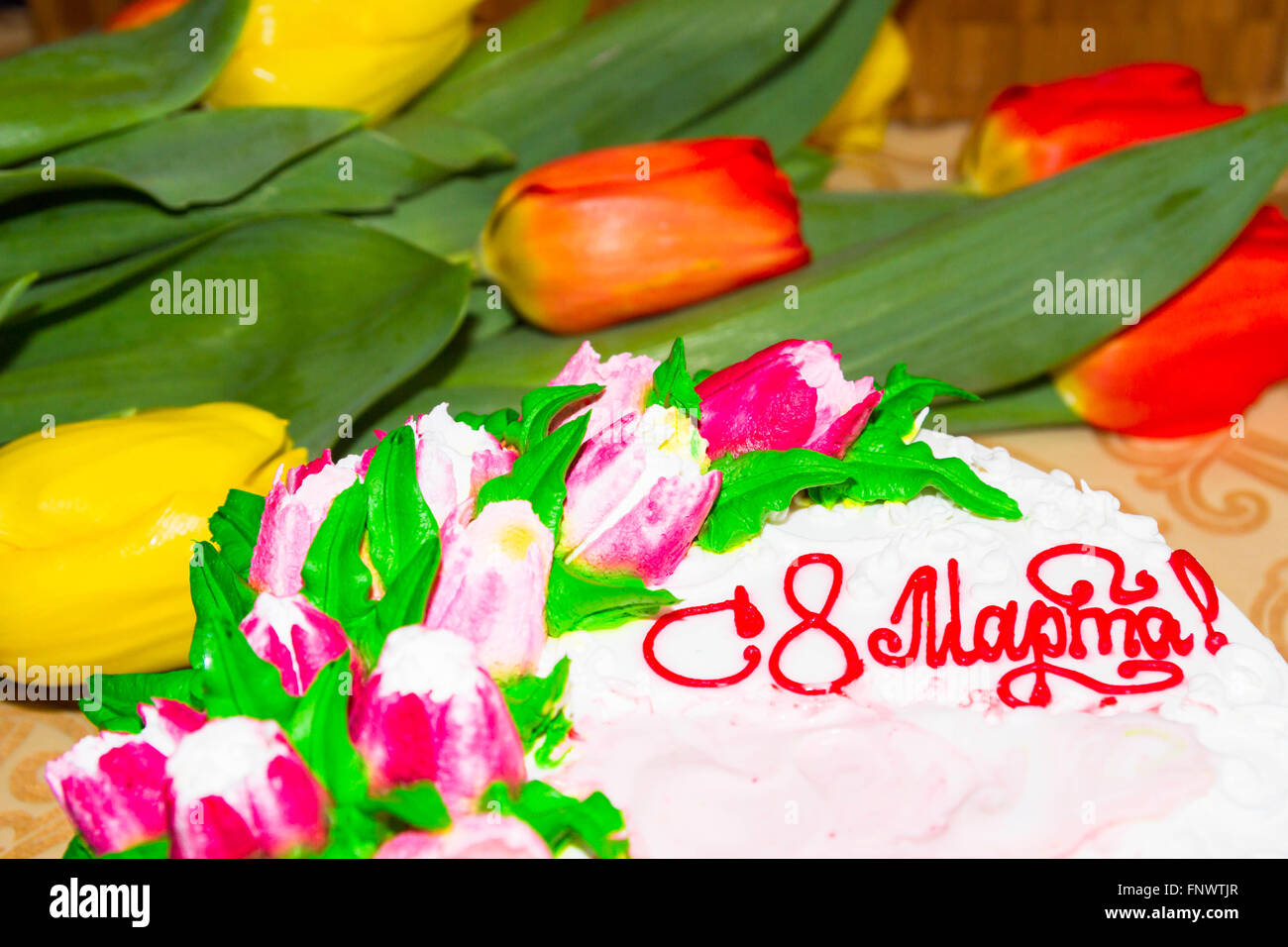 Beautiful cake for March 8 with tulips Stock Photo - Alamy