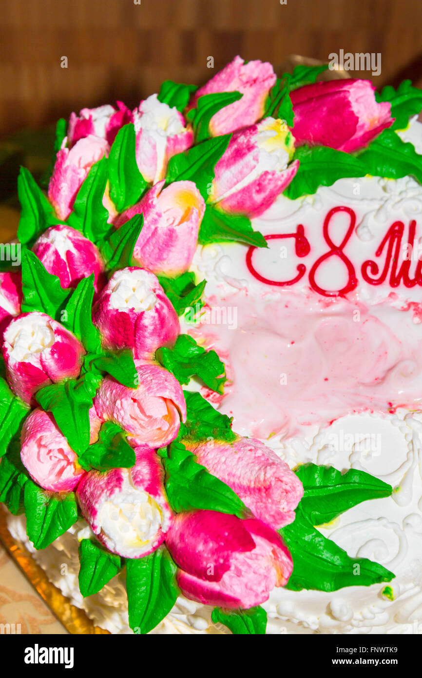 Beautiful cake for March 8 with tulips Stock Photo - Alamy