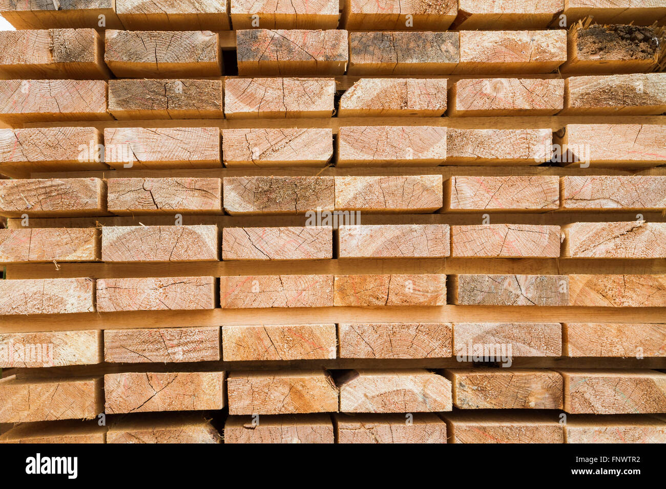 Wooden planks to build a house on a stack of folded construction base ...