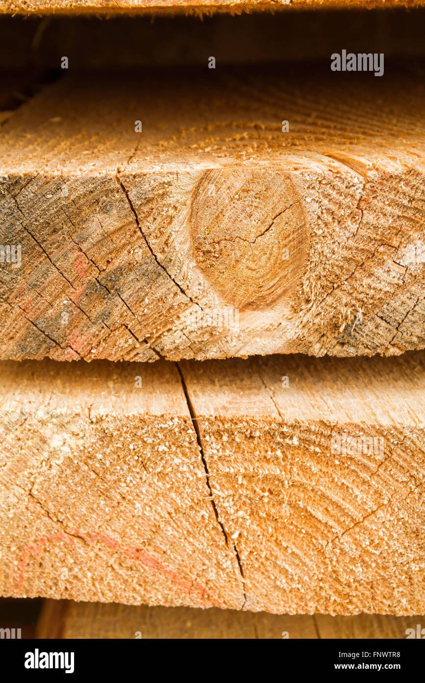 Wooden planks to build a house on a stack of folded construction base ...