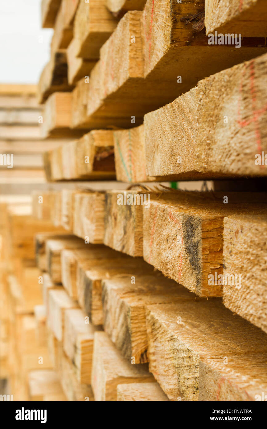 Wooden planks to build a house on a stack of folded construction base ...