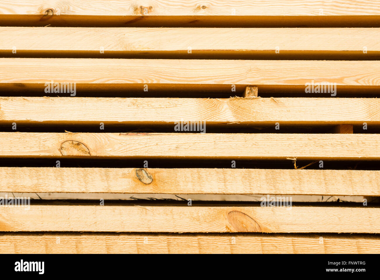 Wooden planks to build a house on a stack of folded construction base ...