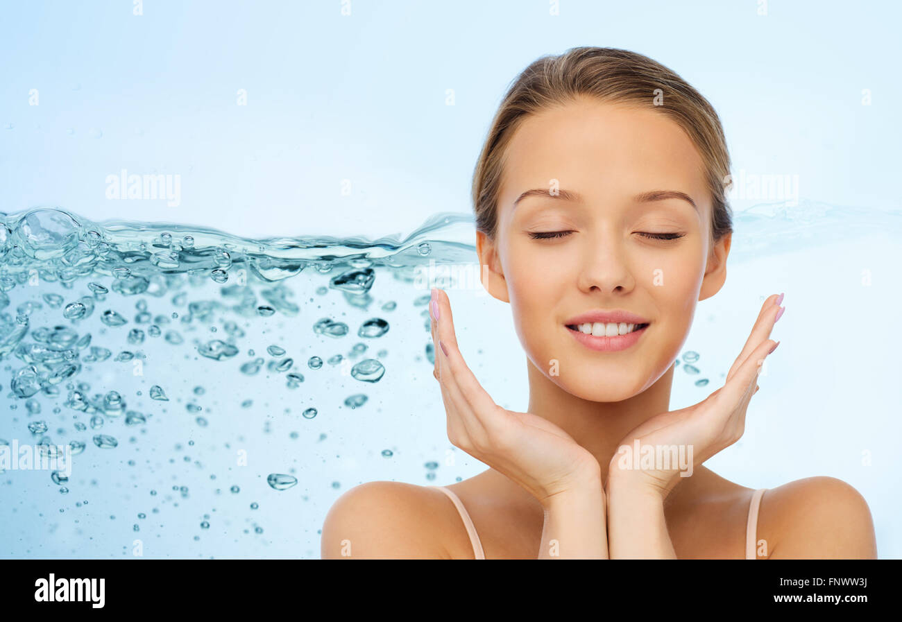 smiling young woman face and hands Stock Photo - Alamy