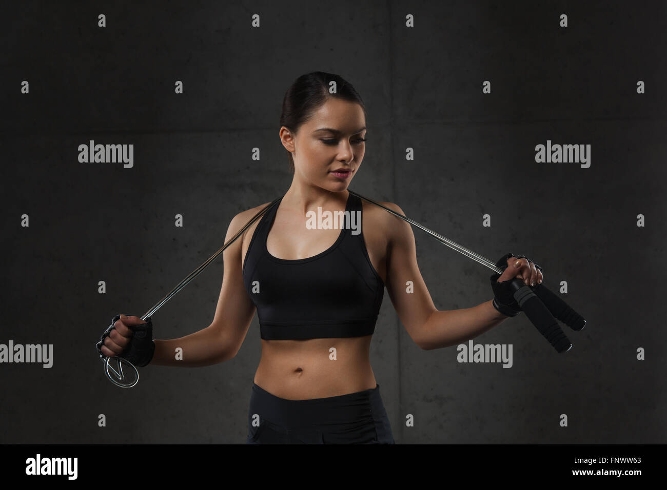 young sporty woman with jumping rope Stock Photo - Alamy