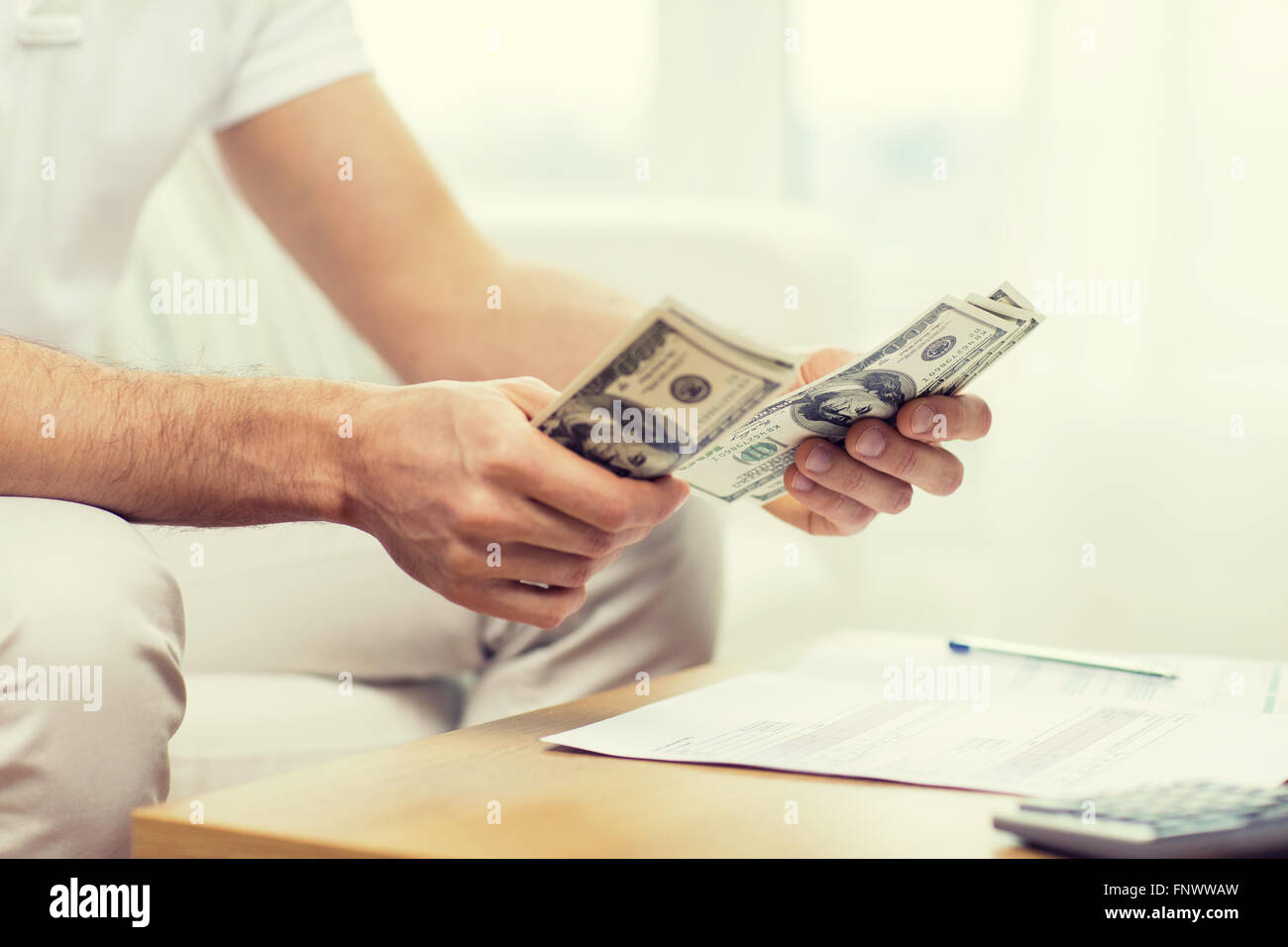 close up of man hands counting money at home Stock Photo - Alamy