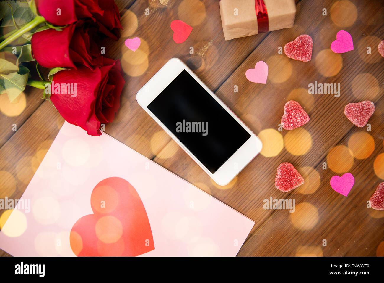 close up of smartphone, gift, red roses and hearts Stock Photo - Alamy