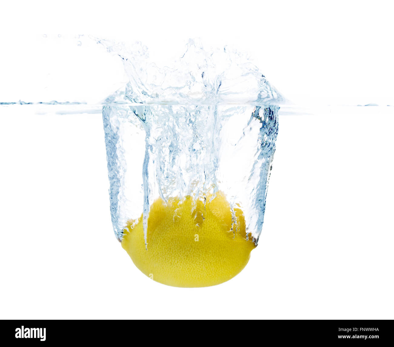 lemon falling or dipping in water with splash Stock Photo - Alamy