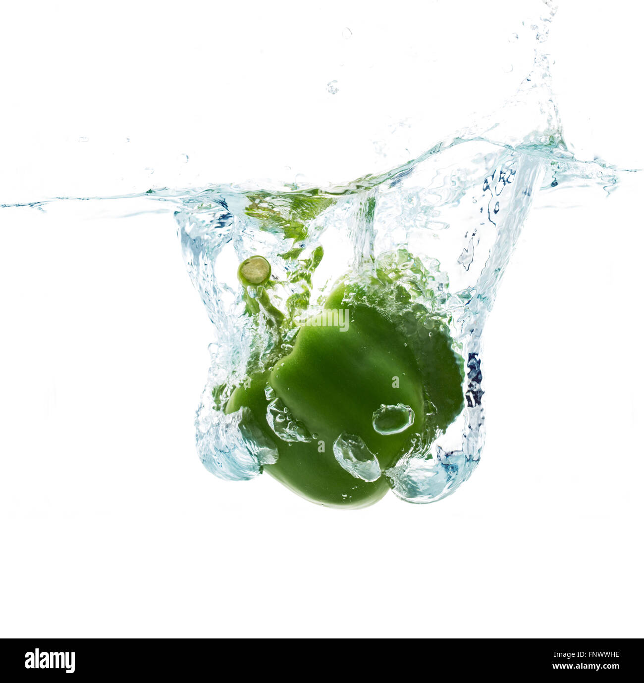 pepper falling or dipping in water with splash Stock Photo - Alamy