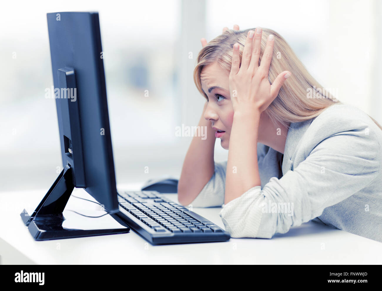 stressed woman with computer Stock Photo - Alamy