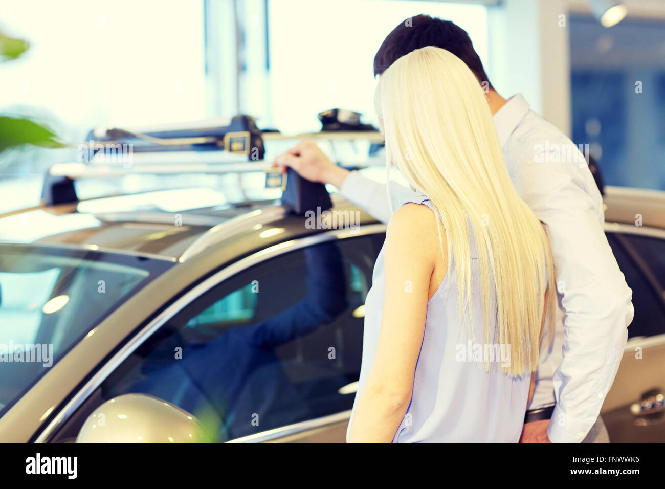 Woman looking into car buying hi-res stock photography and images - Alamy