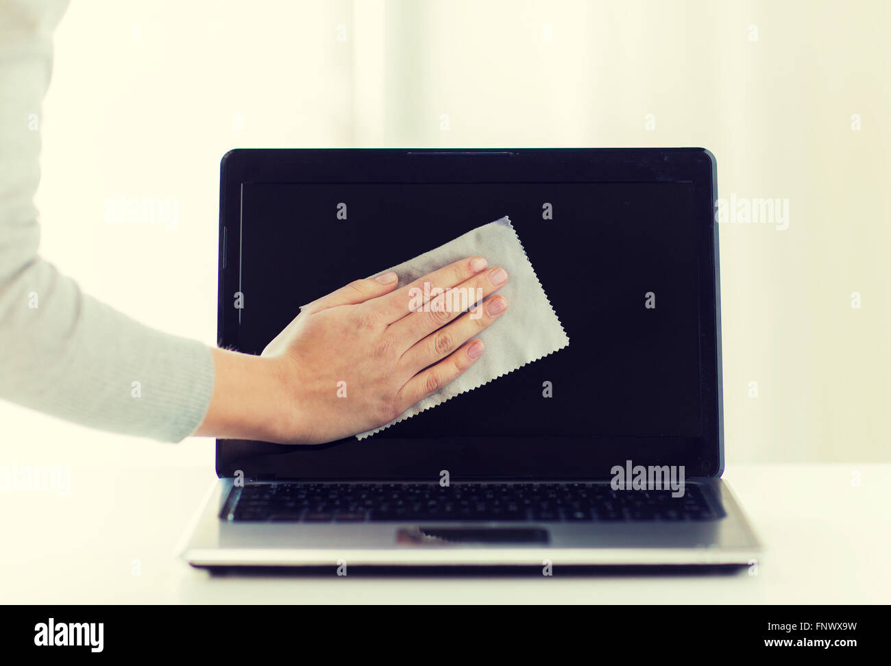 close up of woman hand cleaning laptop screen Stock Photo - Alamy