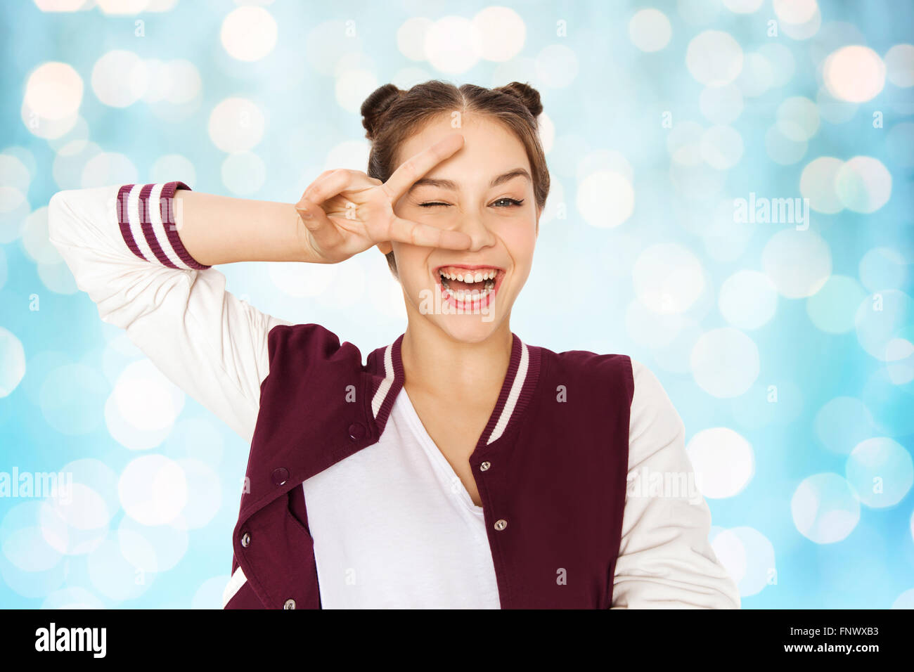 happy smiling teenage girl showing peace sign Stock Photo - Alamy