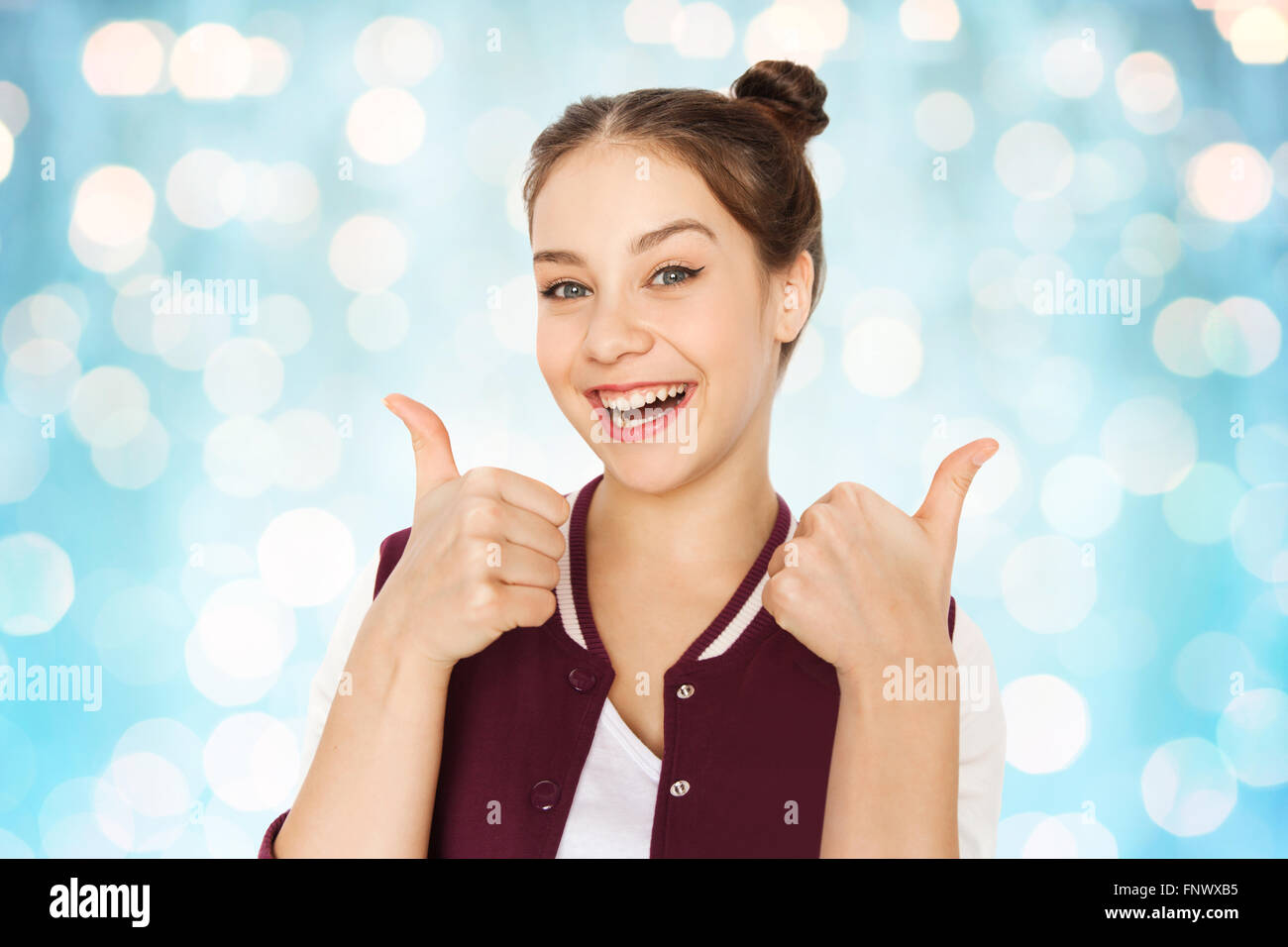 happy smiling teenage girl showing thumbs up Stock Photo - Alamy