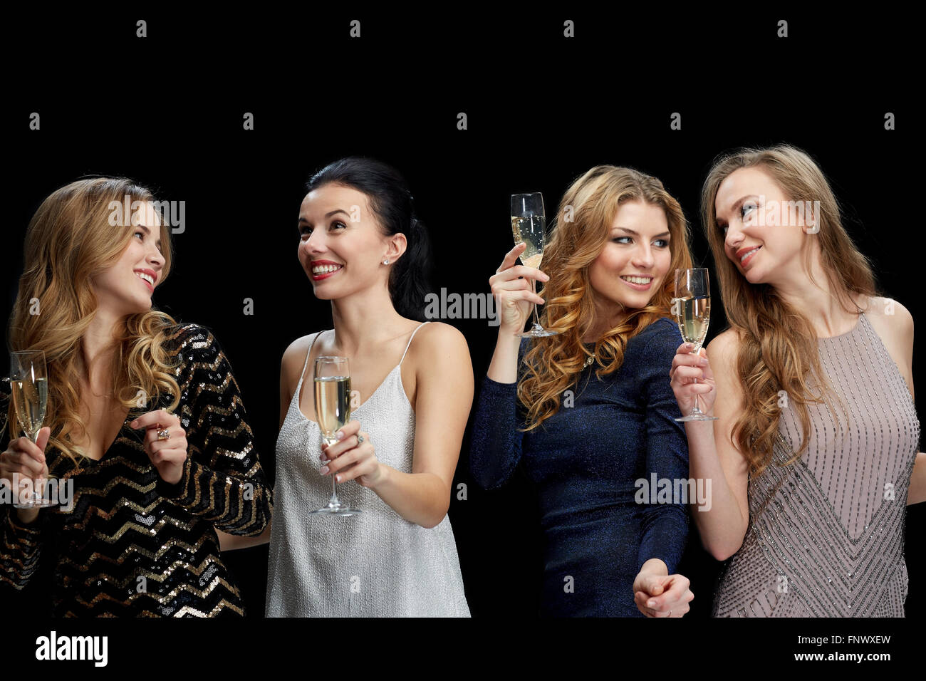 happy women with champagne dancing over black Stock Photo - Alamy