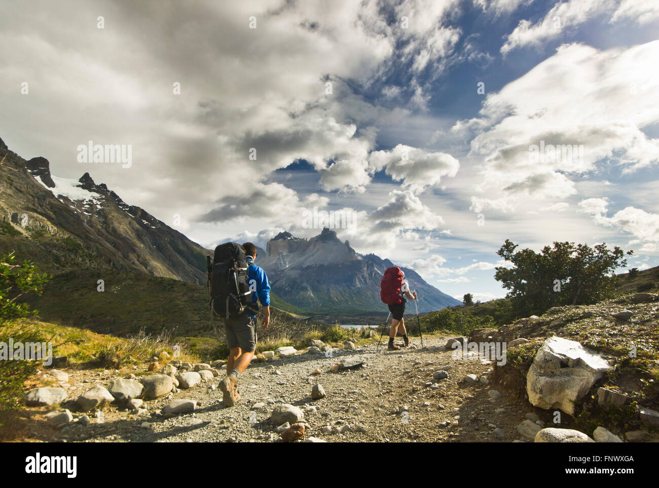two men hiking in patagonia mountains, torres del paine Stock Photo - Alamy
