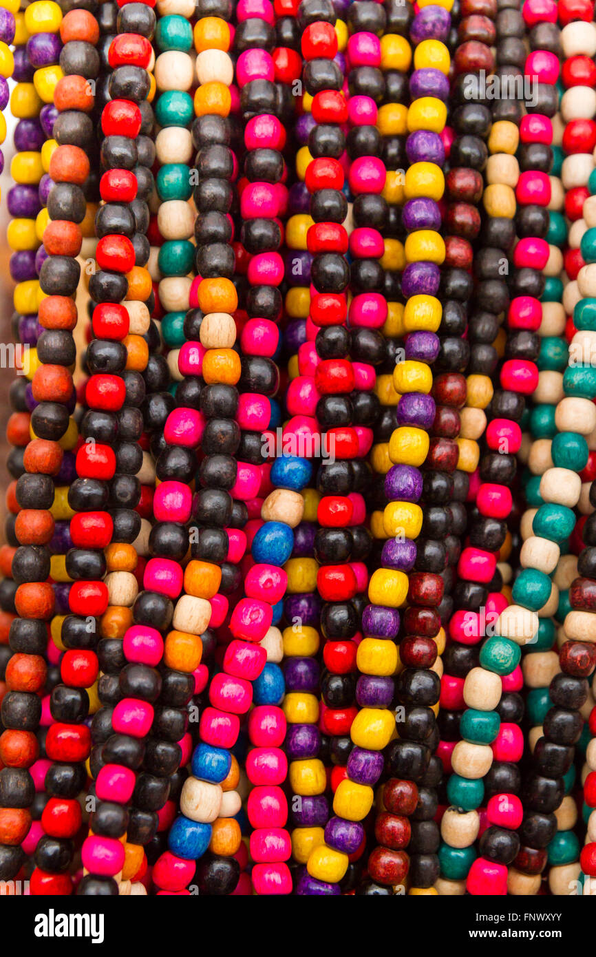 Wooden colored beads hanging in the gift shop Stock Photo - Alamy