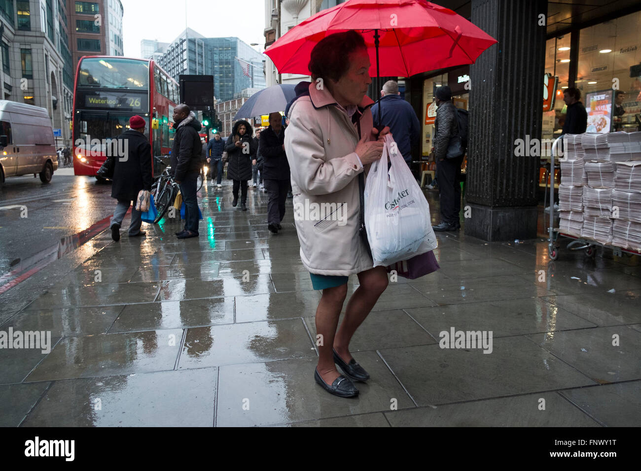 People out and about in the rain in the City of London, England, UK ...