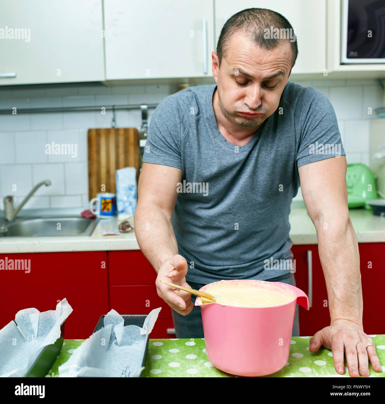 Angry cook having spoiled a dessert recipe Stock Photo - Alamy