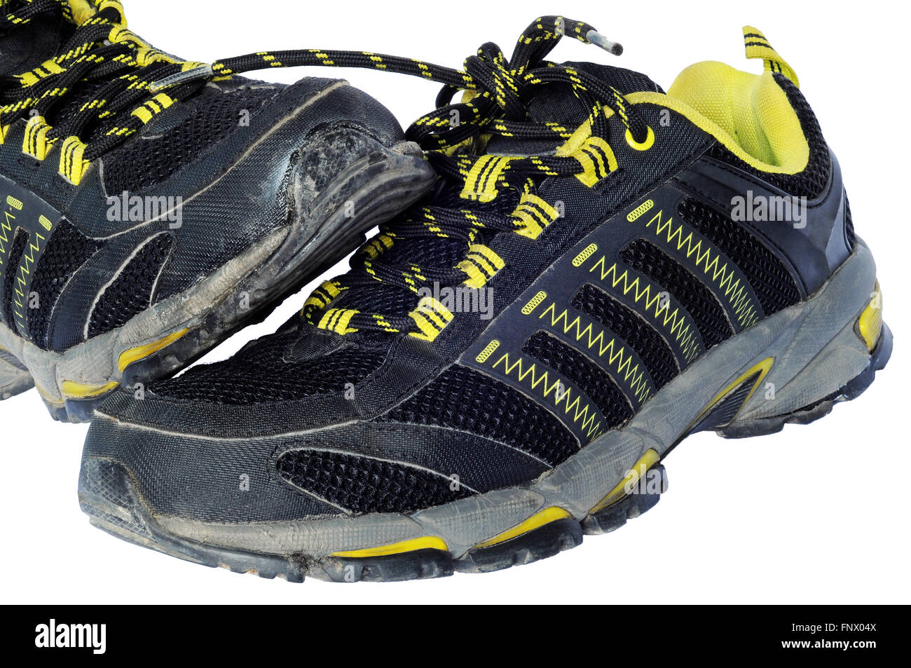 Black and yellow colored used running, sport shoes Stock Photo - Alamy