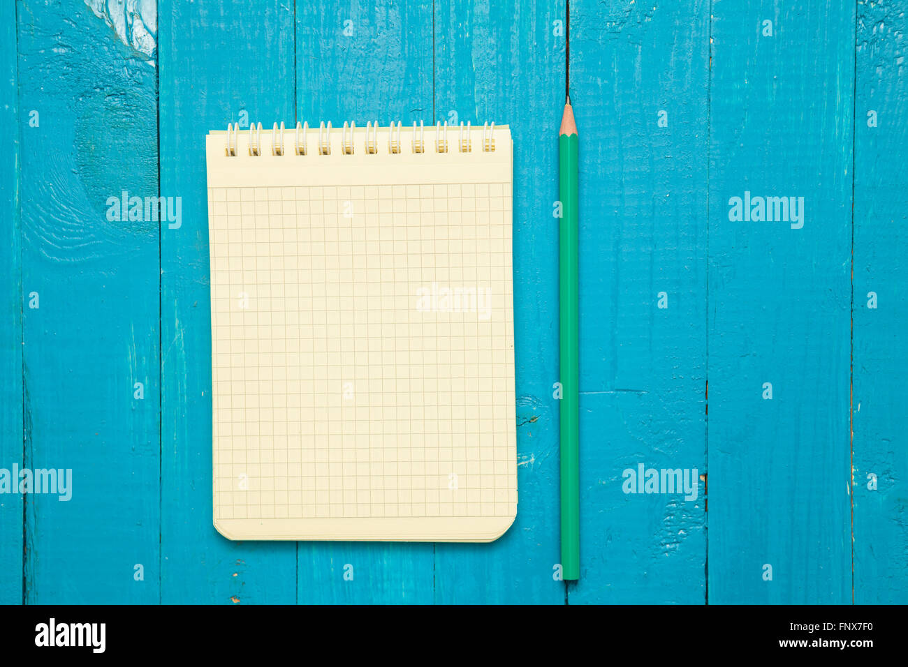 notebook on a blue wooden background Stock Photo - Alamy