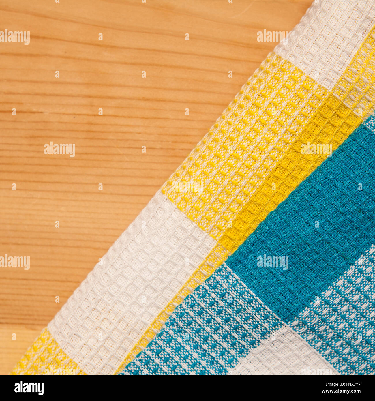 Two checkered towels on wooden background Stock Photo - Alamy
