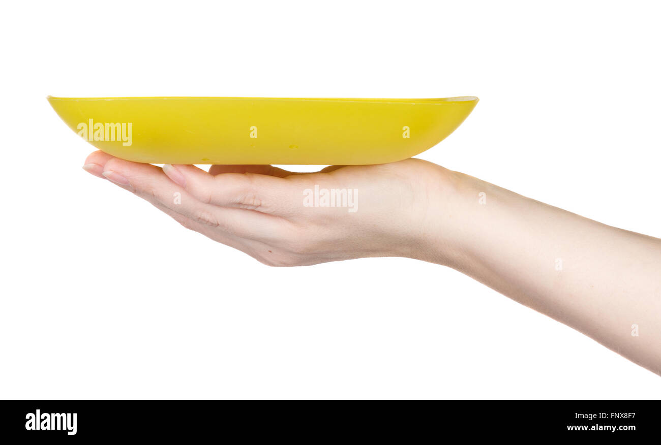 yellow plate on a female hand on a white background Stock Photo - Alamy