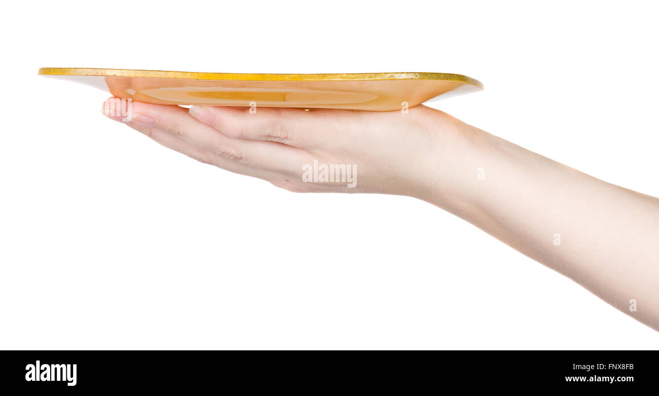 yellow plate on a female hand on a white background Stock Photo - Alamy