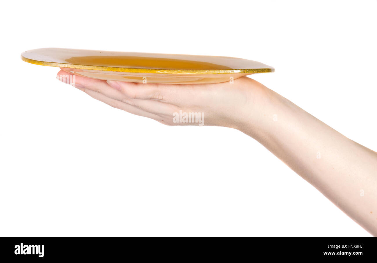 yellow plate on a female hand on a white background Stock Photo - Alamy