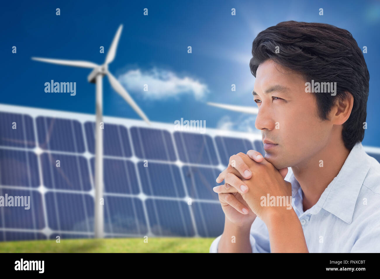 Composite image of thinking man with hands together Stock Photo - Alamy
