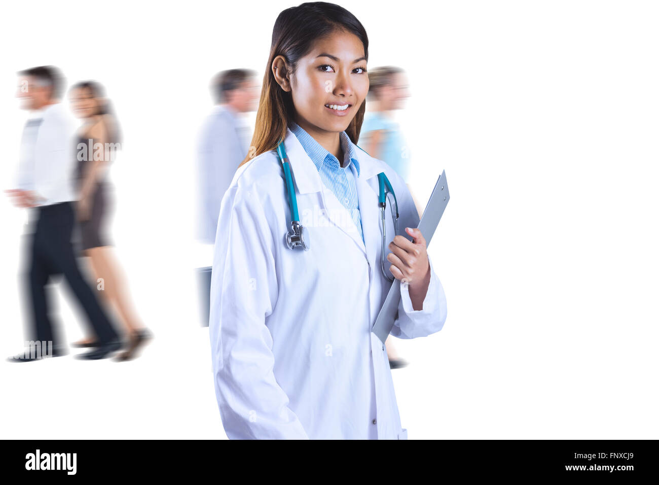 Composite image of asian doctor holding clipboard Stock Photo - Alamy