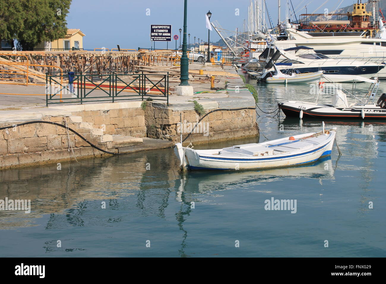Small white row boat on water ready for fishing vacation Stock Photo ...