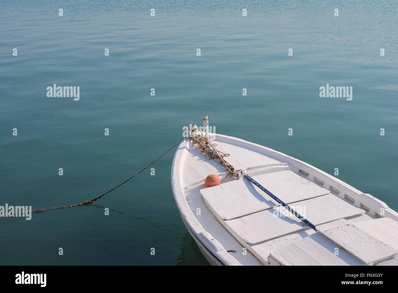 Small white row boat on water ready for fishing vacation Stock Photo ...