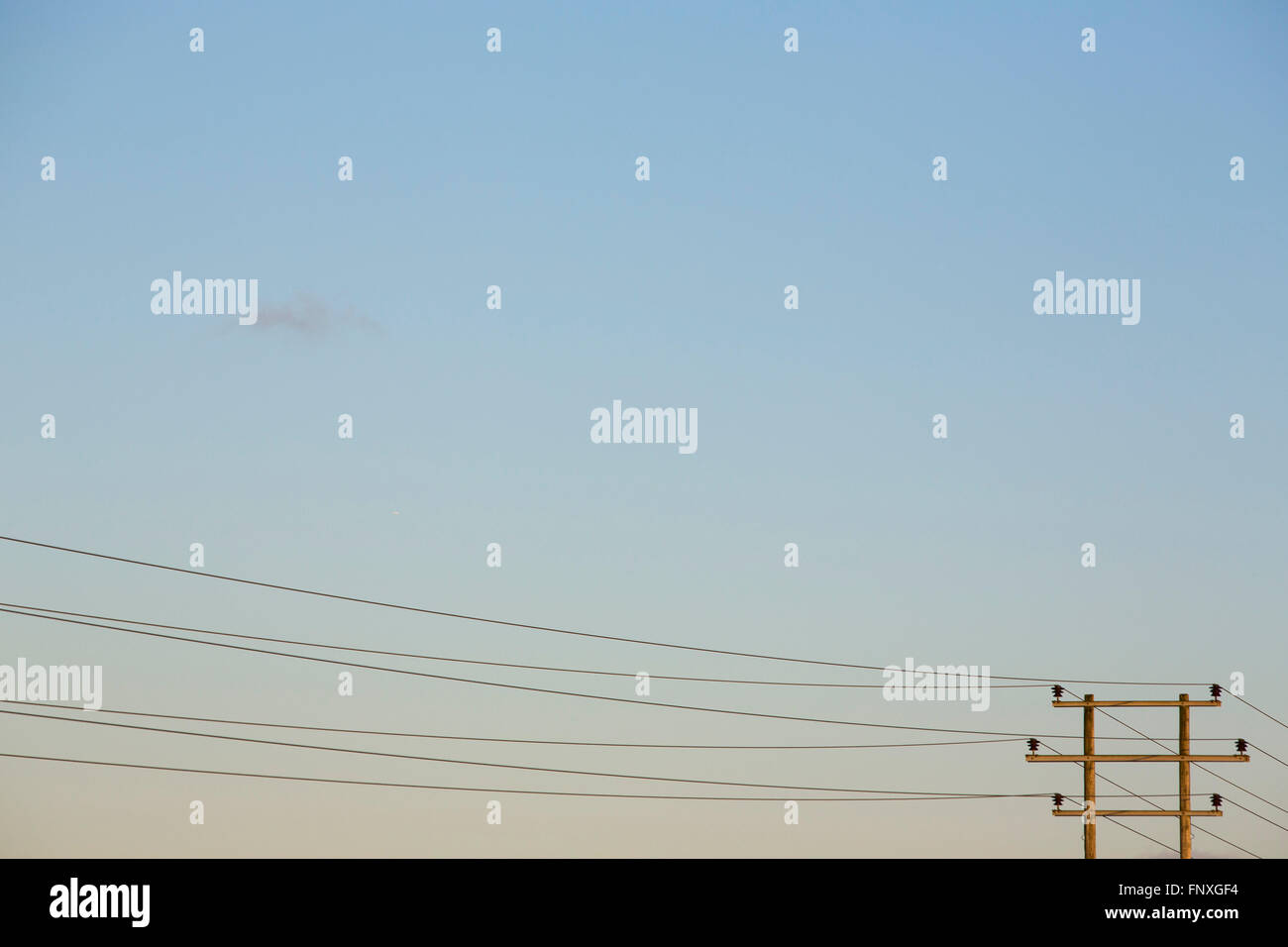 Electrical power lines in the colouring sky as the sunsets Stock Photo ...