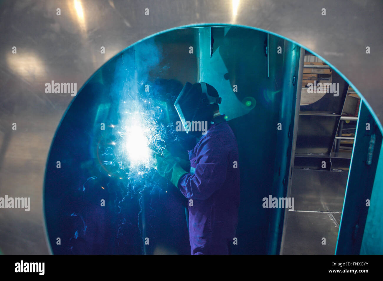 an engineer welding in a work environment with a welding torch Stock ...