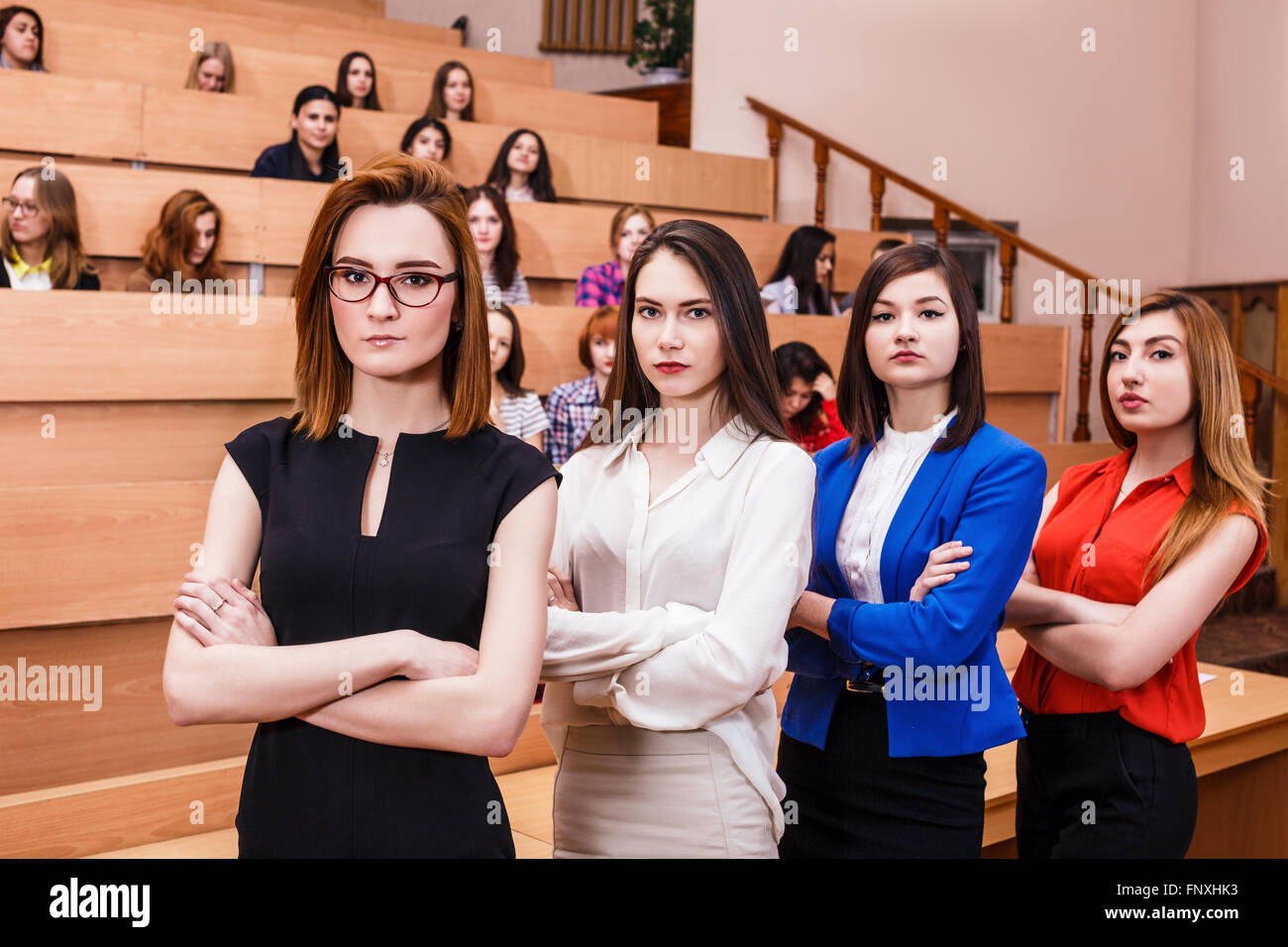 Young women in classroom with students Stock Photo - Alamy
