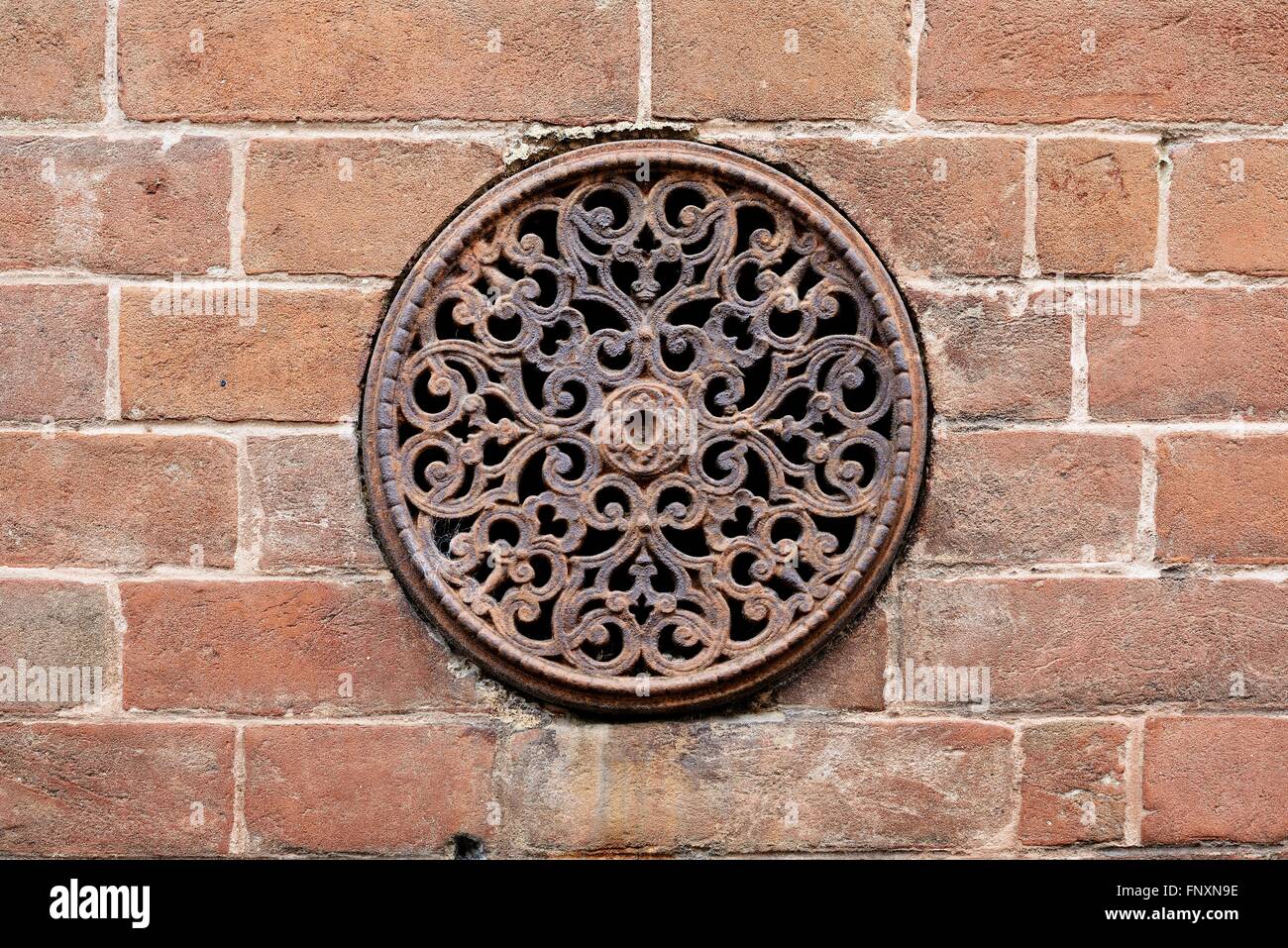 Round decoration on bricks wall Stock Photo - Alamy