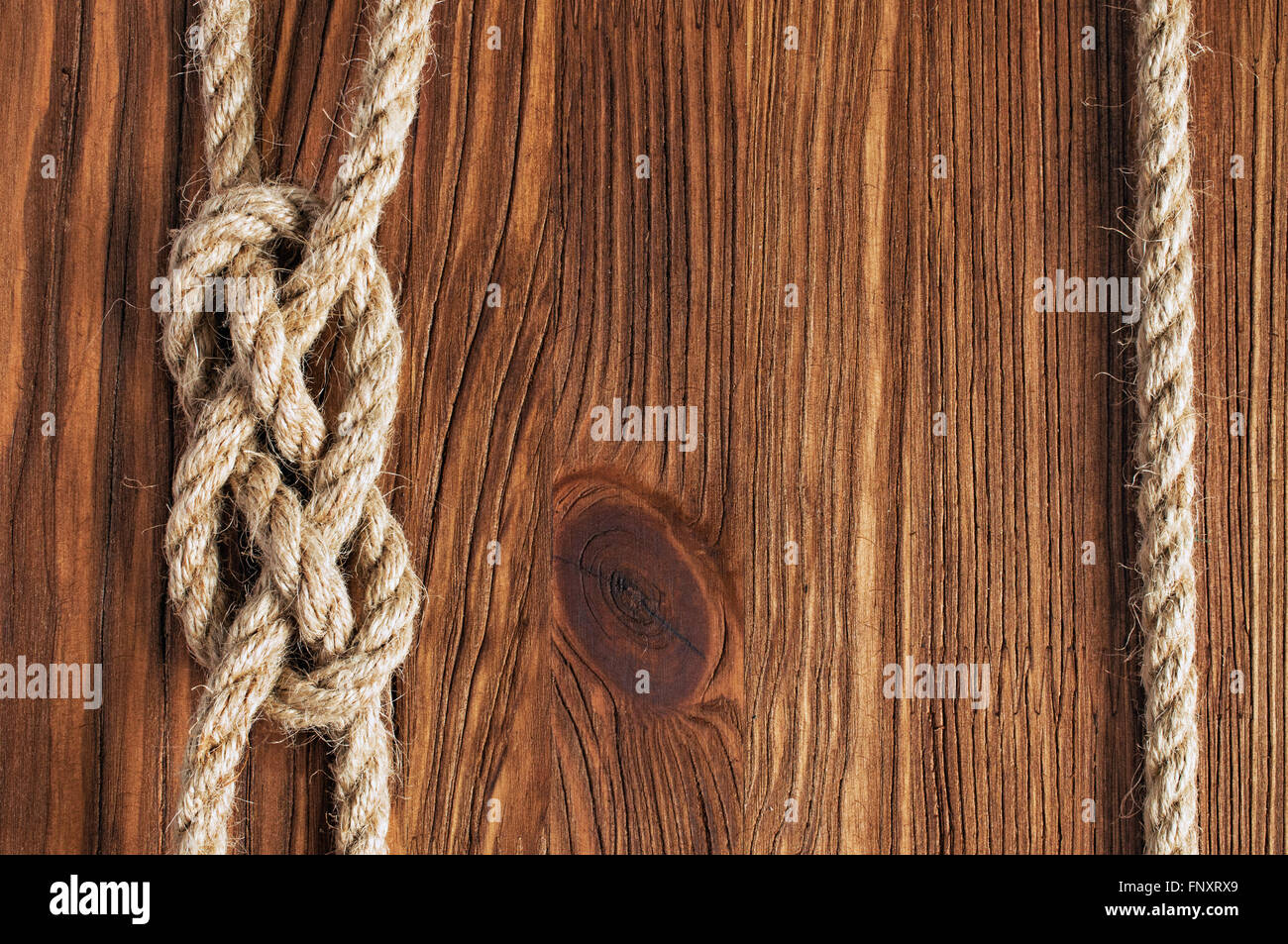 Nautical background with sailor's knot and rope Stock Photo - Alamy